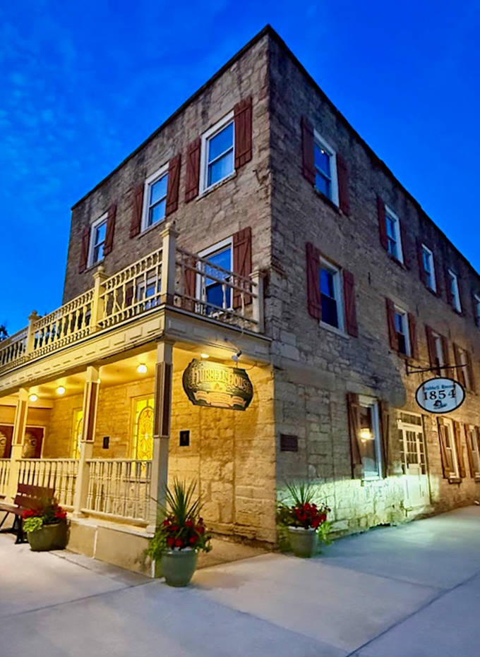 As twilight falls, the limestone exterior glows with warmth, beckoning travelers just as it has for over 165 years.