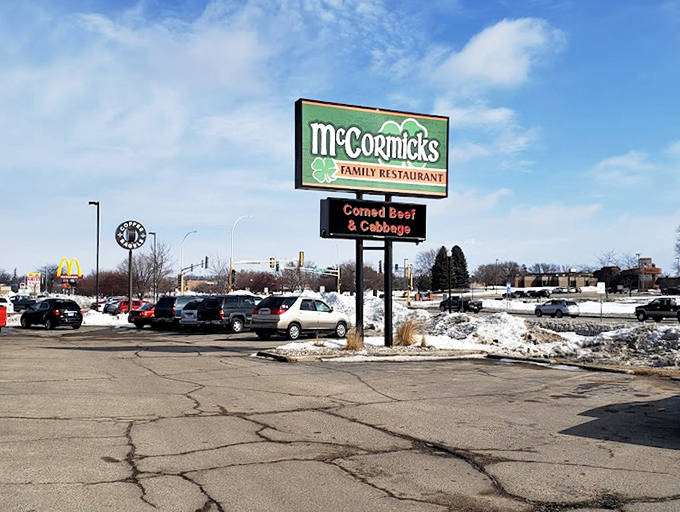 The roadside sign announces daily specials like "Corned Beef & Cabbage," a beacon of hope for hungry travelers seeking authentic comfort food.