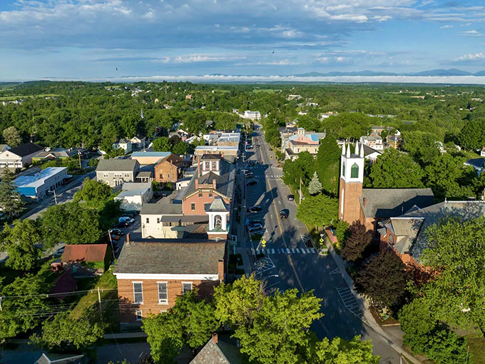From above, Vergennes reveals itself as a perfect small city nestled in Vermont's verdant landscape, with church spires punctuating the skyline.