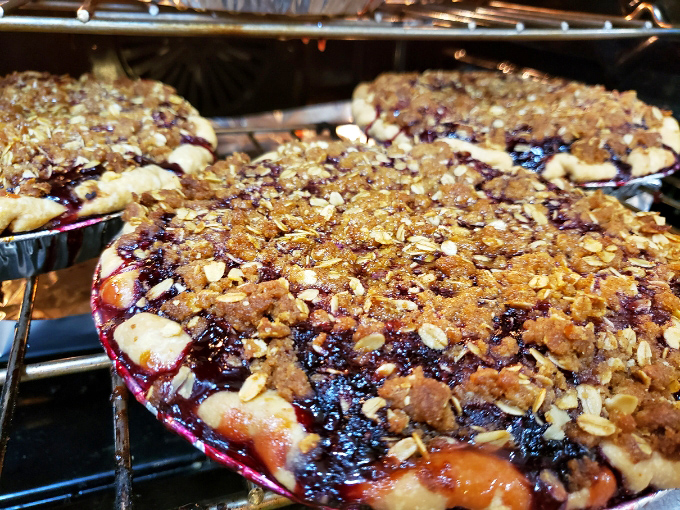 Blackberry peach crumble pie bubbling with purple-red juices beneath a golden oat topping &ndash; summer's greatest hits album in edible form.
