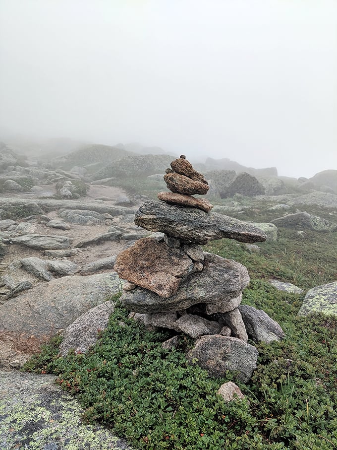 Stone cairns stand like wilderness bread crumbs, whispering, "Others have made it, and so will you."