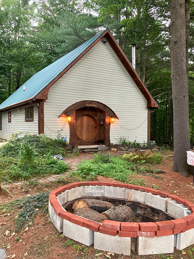 Even the outbuildings maintain the storybook aesthetic with their round doors and thoughtful landscaping.