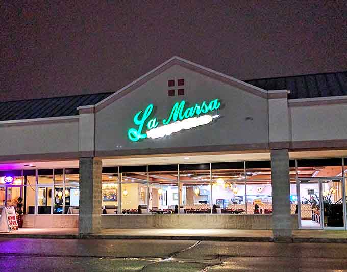 La Marsa's glowing sign beckons food adventurers to explore Mediterranean flavors without leaving Michigan's welcoming embrace.