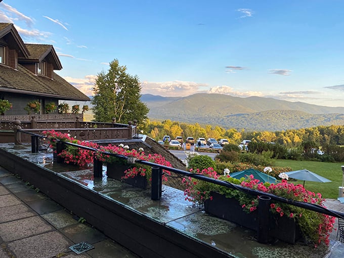 Flower boxes overflow with Alpine blooms, framing mountain views that change hourly as light plays across Vermont's verdant landscape.