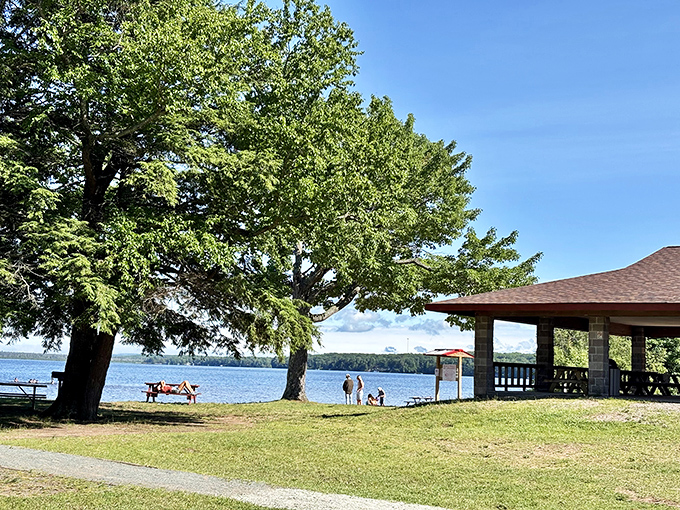 Picnic tables wait patiently by the shore &ndash; front-row seats to Lake Independence's daily performance of "Waves Gently Lapping."