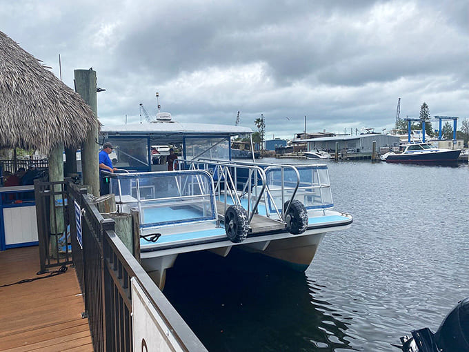 Safely docked and ready for the next voyage, the tour boat rests at the wharf where countless adventures begin and end.