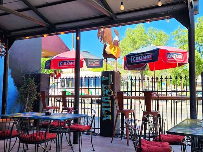 Patio seating under umbrellas provides the perfect spot for enjoying meals while soaking up Arizona's famously beautiful weather.