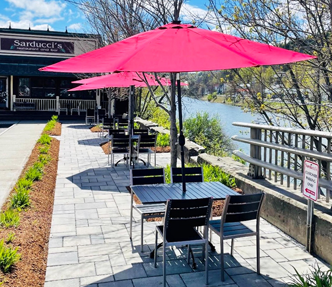 Outdoor dining with those signature pink umbrellas offers river views and fresh air &ndash; summer in Vermont doesn't get better than this.