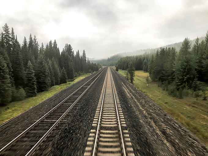 Rails stretch endlessly through misty forests, promising adventures that no interstate highway could ever hope to deliver or match.