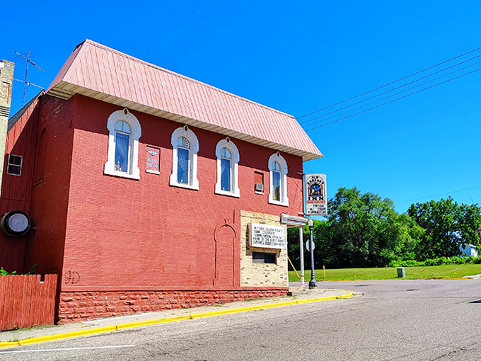 The distinctive red brick exterior stands as a landmark in downtown Baraboo&mdash;a building that has reinvented itself repeatedly while never quite letting go of its past.