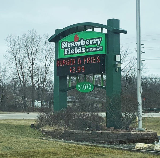 The roadside sign announces daily specials to passing traffic, tempting drivers to make an unplanned stop for breakfast they didn't know they needed.