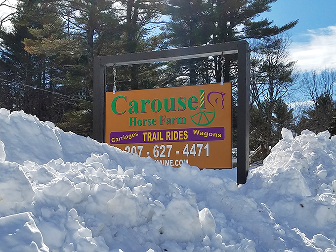 The welcoming sign emerges from winter's embrace, promising adventures that transform ordinary Maine winters into extraordinary memories.