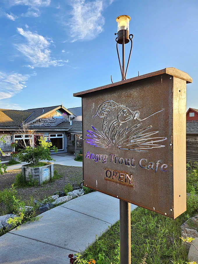 The rustic metal sign stands as both invitation and promise &ndash; beyond this point, unforgettable Lake Superior dining experiences await the fortunate traveler.
