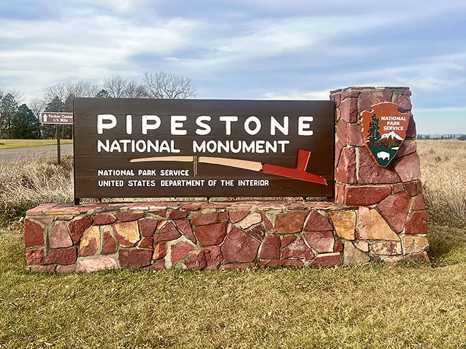 The monument's entrance sign welcomes travelers to a place where Minnesota reveals one of its most culturally significant and geologically fascinating treasures.