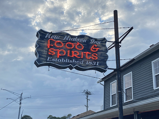 "FOOD & SPIRITS" indeed &ndash; the neon sign glows like a beacon for hungry travelers and locals seeking authentic Michigan hospitality.