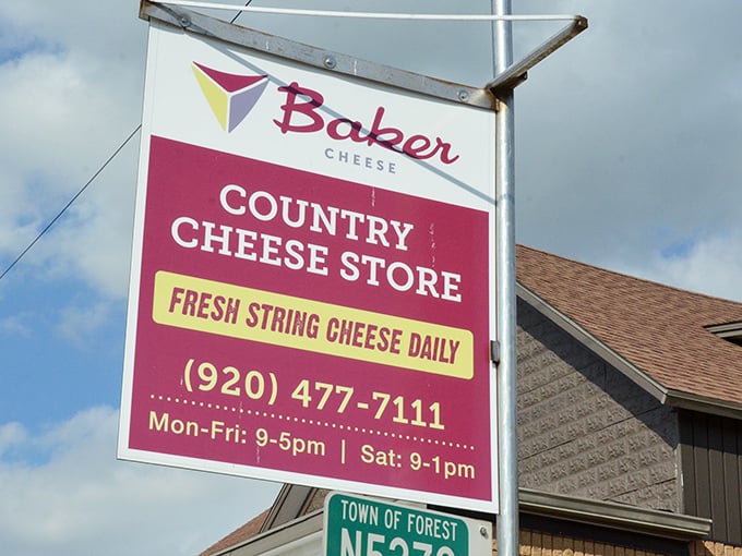 The Baker Cheese Country Store sign proudly announces "FRESH STRING CHEESE DAILY" &ndash; five words that justify any road trip.