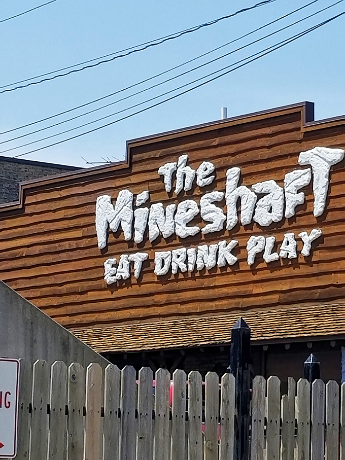 The Mine Shaft's distinctive signage stands as a beacon of good times – no actual mining experience required for entry.