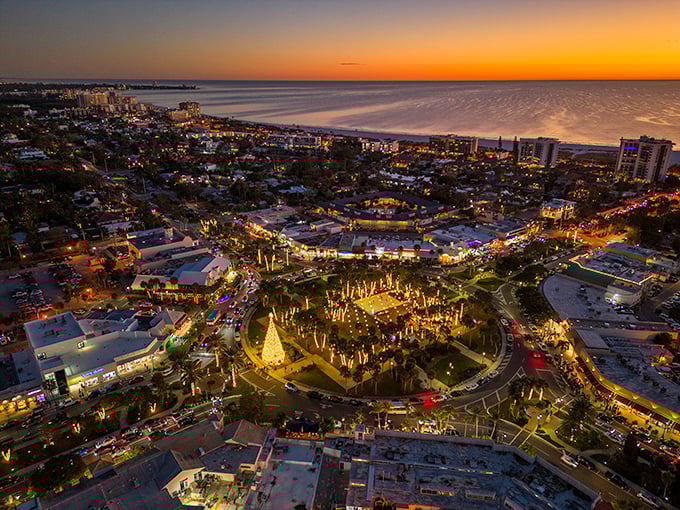 As night falls, St. Armands Circle transforms into a magical wonderland of lights, creating a dining and shopping atmosphere that rivals any European piazza.