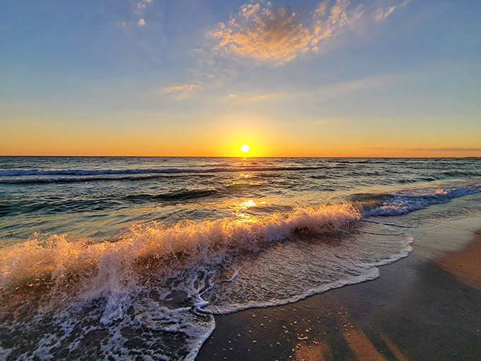 Nature's masterpiece paints the Gulf waters with liquid gold, as gentle waves provide the perfect soundtrack to end a perfect day.