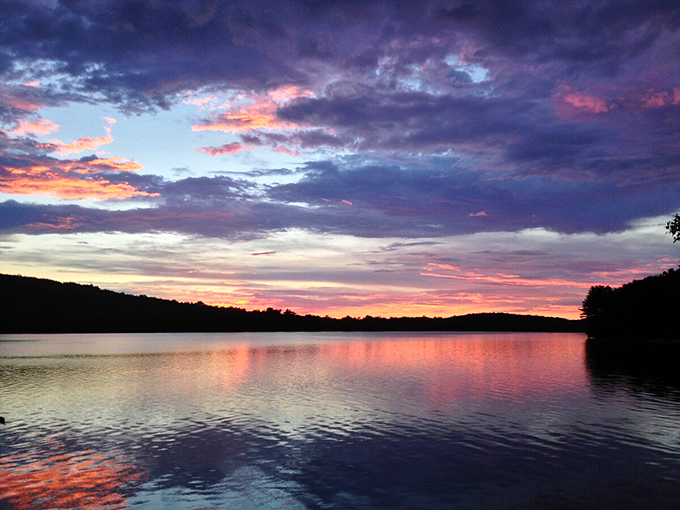 When day bids farewell over Lake Iroquois, the sky erupts in a color show that makes professional photographers weep with joy.