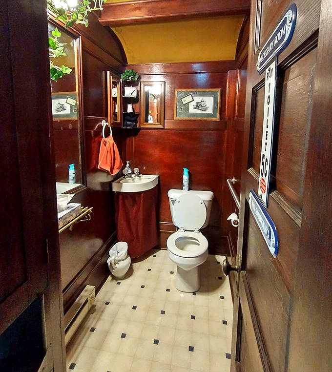 This charming "Necessary Room" combines classic railcar woodwork with modern comforts and a touch of playful, historic train décor.