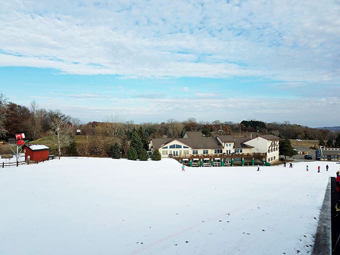 The lodge anchors the entire operation, offering warmth and sustenance to cold tubers who've earned every bite of that hot meal.