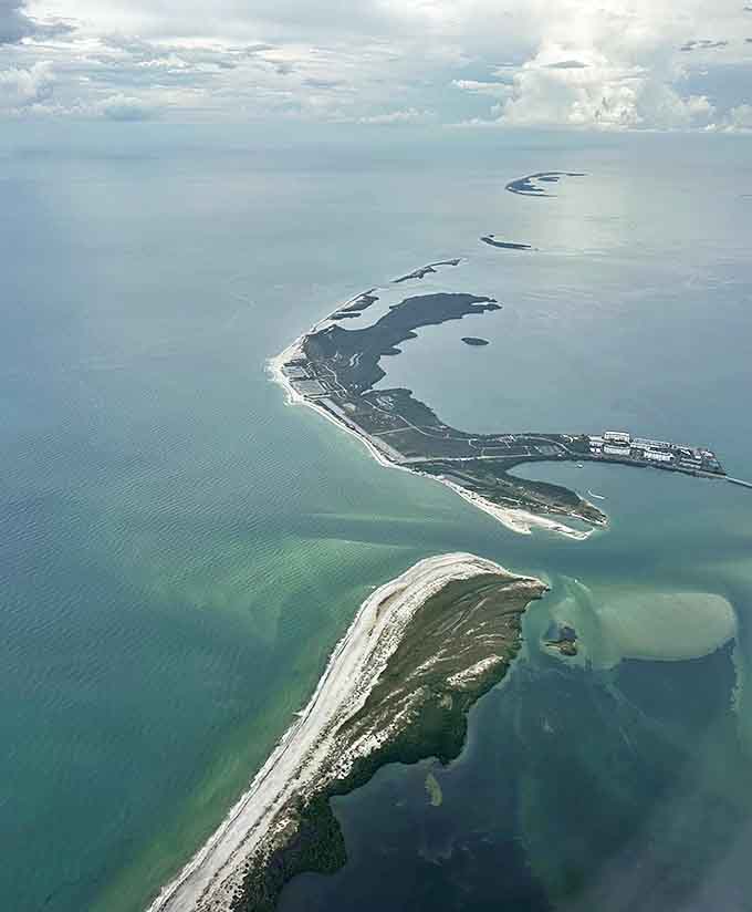 Bird's eye treasure: An aerial view reveals Caladesi's perfect crescent beaches and protected inland areas, a natural jewel in Florida's increasingly developed coastline.