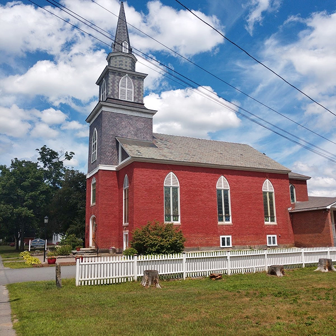The red brick church with its pristine white fence, Sunday services here come with a side of picture-perfect New England charm.