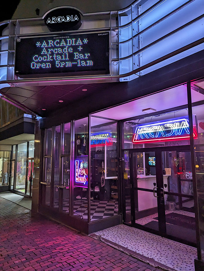 As evening falls, Arcadia's entrance becomes a beacon of electric promise, its neon sign a lighthouse guiding fun-seekers to safe harbor.