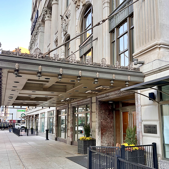 The historic entrance beckons with promises of luxury within &ndash; step through these doors and into a world where Detroit's past meets its future.