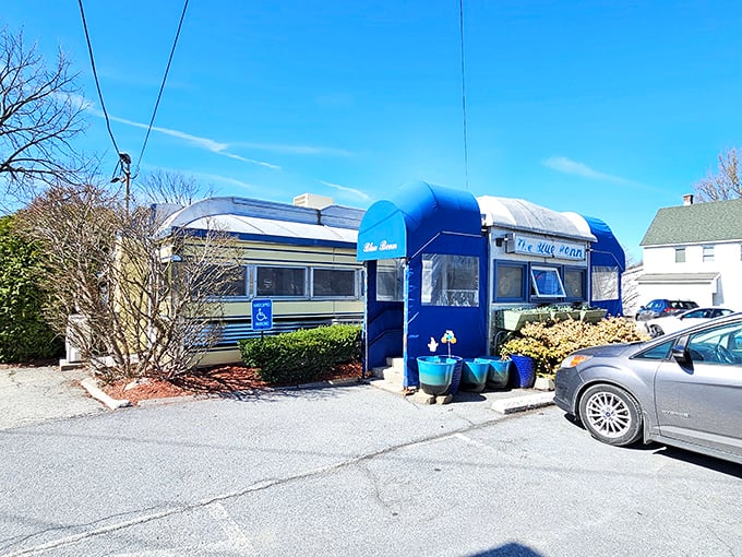 Another view of the Blue Benn's distinctive exterior, with its vibrant blue awnings and classic railcar silhouette that's been drawing diners for generations.