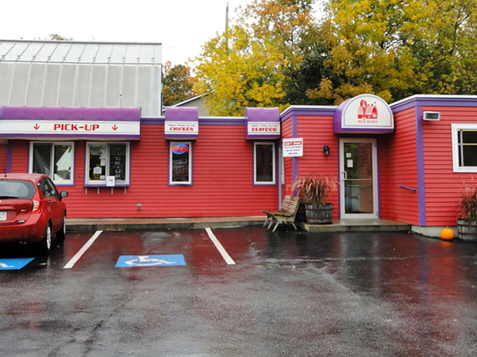 Red picnic tables create a community dining experience under open skies. Where strangers become friends over shared love of perfectly fried seafood.