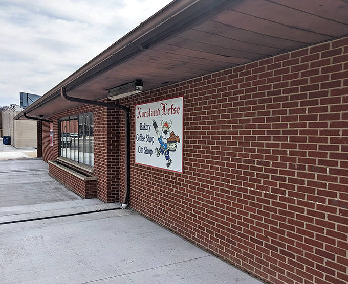 The side view reveals the modest charm of this cultural institution. That Norwegian flag isn't just decoration &ndash; it's a promise of authenticity.