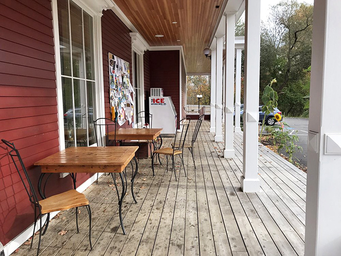 Porch Dining: Maine's perfect outdoor dining spot – simple wooden tables where pizza steam rises against the backdrop of rural tranquility.