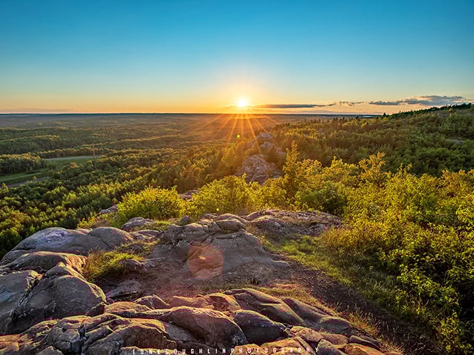 Sunset serenity: The golden hour transforms Ely's Peak into a meditation spot, where Minnesota's beauty unfolds in panoramic splendor.