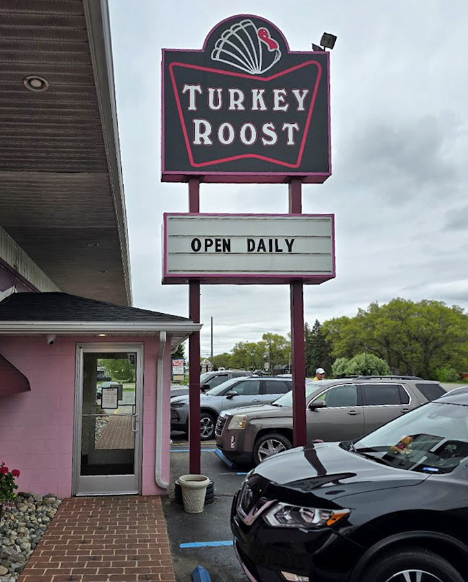 The iconic Turkey Roost sign stands tall, a beacon for hungry travelers and locals alike seeking turkey-centered comfort food.