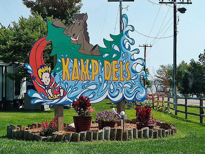 This playful entrance sign captures the spirit of Kamp Dels &ndash; where water adventures and childhood joy come together in perfect harmony.