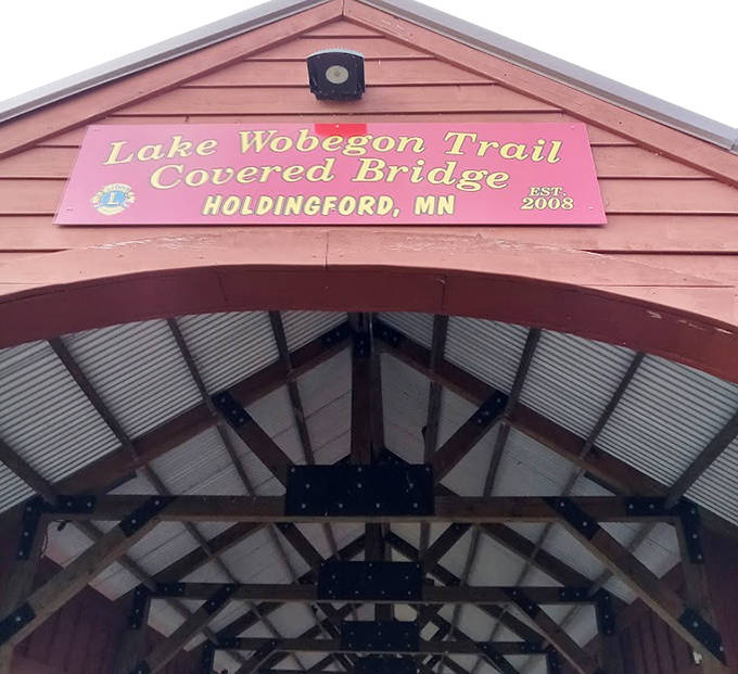 Gateway guardian: This weathered sign stands as a humble introduction to one of Florida's most spectacular natural water features.