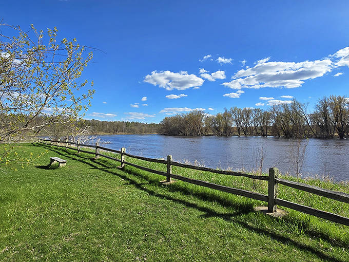 A simple fence frames the Mississippi River view, proving that sometimes the best art galleries have no walls at all.