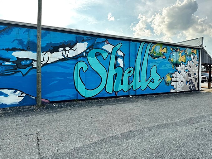 Vibrant underwater artwork splashed across the exterior wall &ndash; a colorful preview of the ocean-to-table experience waiting just inside.