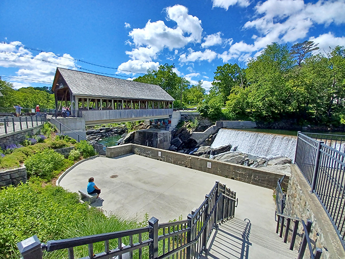 The covered bridge stands as a postcard-perfect symbol of Vermont's rural charm, inviting travelers to pause and appreciate simpler times.
