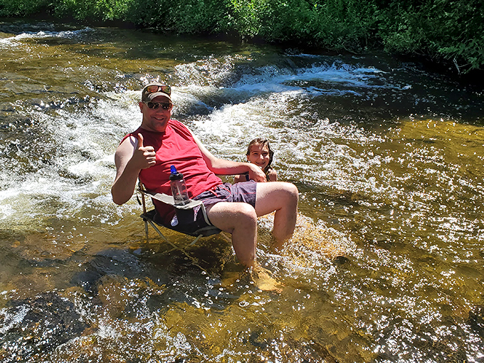 The ultimate summer throne &ndash; a camping chair in rushing water where refreshment comes with every ripple.