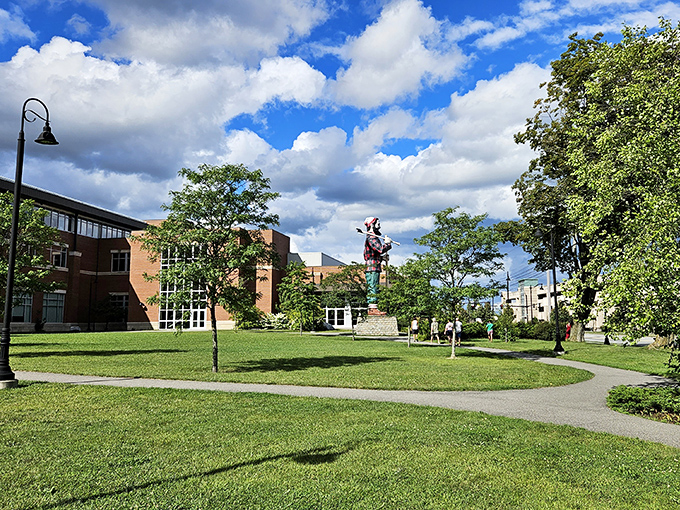 The statue creates a striking silhouette against the clouds, visible from many points throughout downtown Bangor.