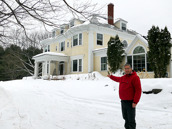 This historic home stands proudly against winter's white canvas, a testament to New England's architectural heritage.