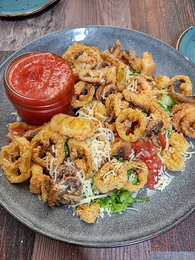 Crispy calamari tossed with fresh herbs and served with zesty marinara &ndash; a starter that sets the bar high for everything that follows.