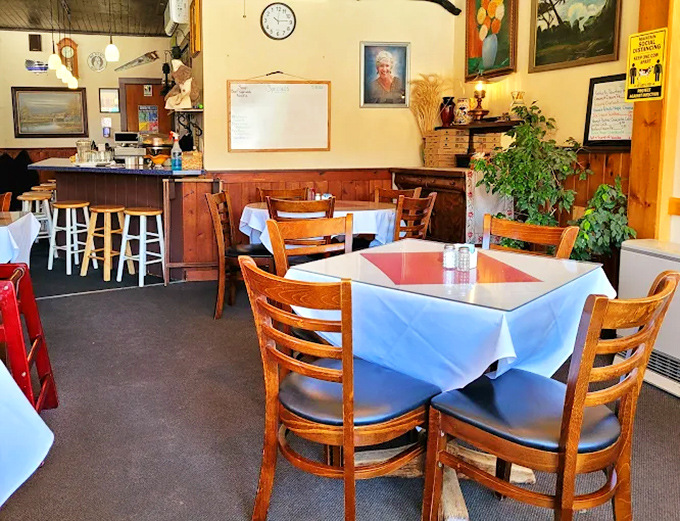 Simple white tablecloths and wooden chairs create an unpretentious dining room where the food, not the decor, rightfully remains the star of the show.