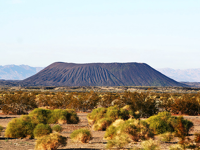 This perfectly formed volcanic cone rises dramatically from the Mojave Desert floor, a natural landmark visible for miles.