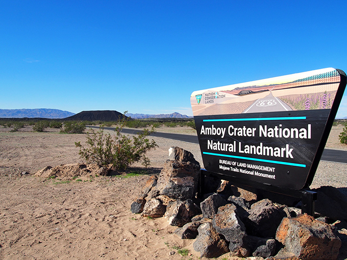 Amboy Crater's black silhouette stands in stark contrast to the surrounding desert, a reminder of California's fiery geological past.