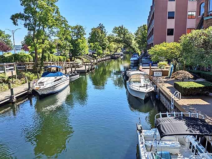 The peaceful canals in Traverse City flow between converted warehouse buildings, creating a distinctive urban landscape connected to nature.