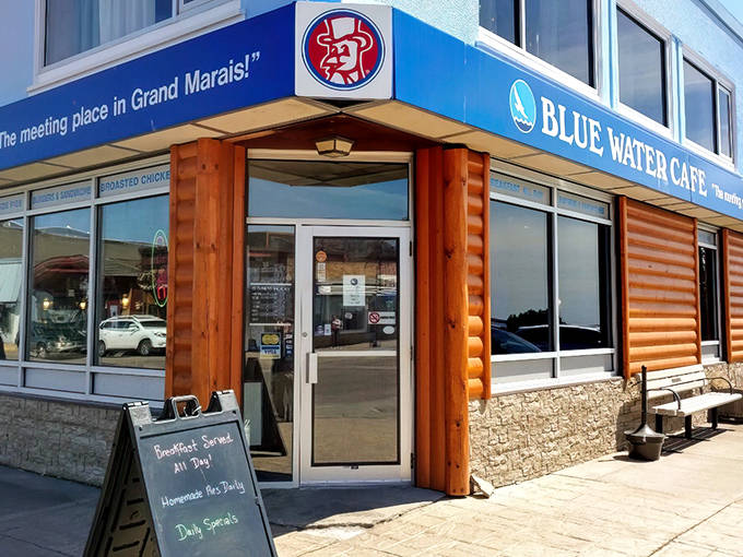 The welcoming storefront of Our House Bistro beckons comfort food seekers with its "twisted comfort food" promise and rustic barrel accents.